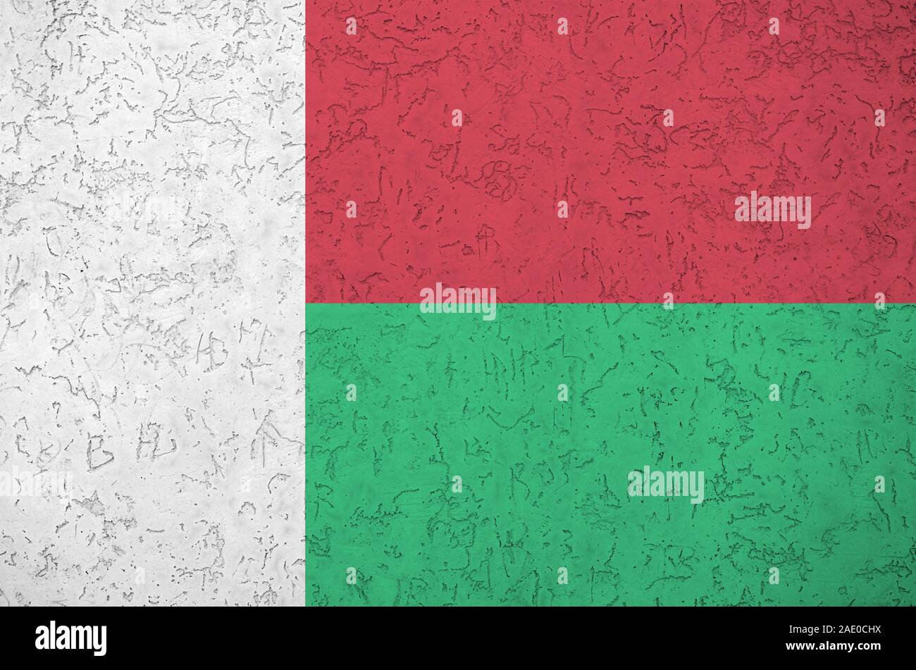 Madagascar flag depicted in bright paint colors on old relief ...