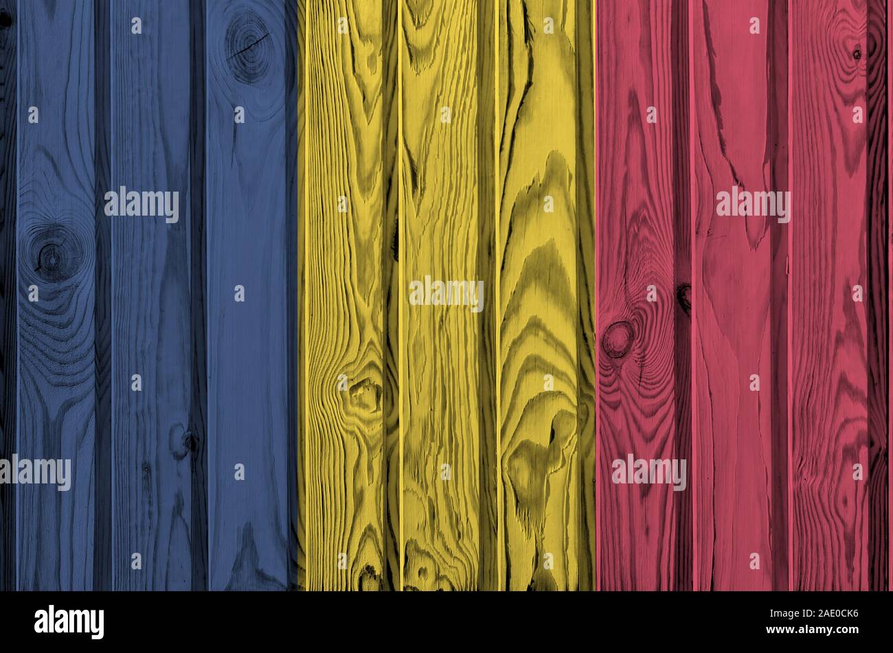 Chad flag depicted in bright paint colors on old wooden wall close up ...