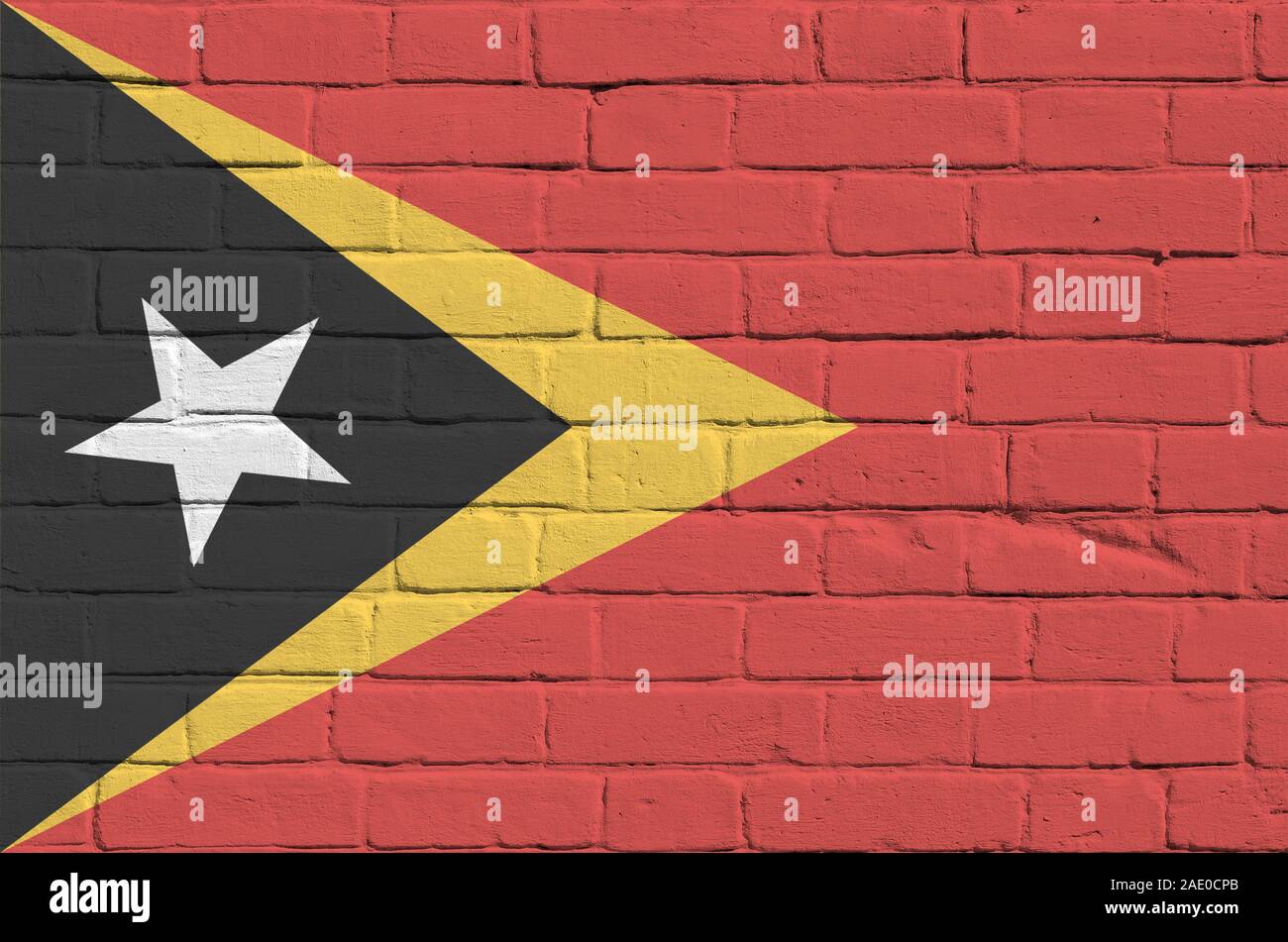 Timor Leste flag depicted in paint colors on old brick wall close up ...