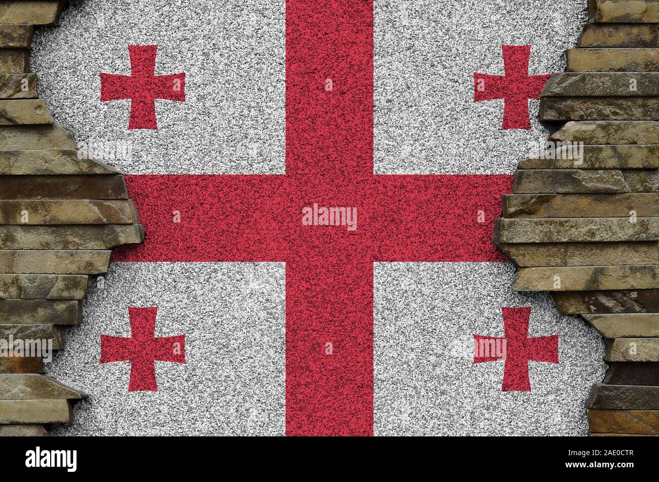 Georgia flag depicted in paint colors on old stone wall close up ...