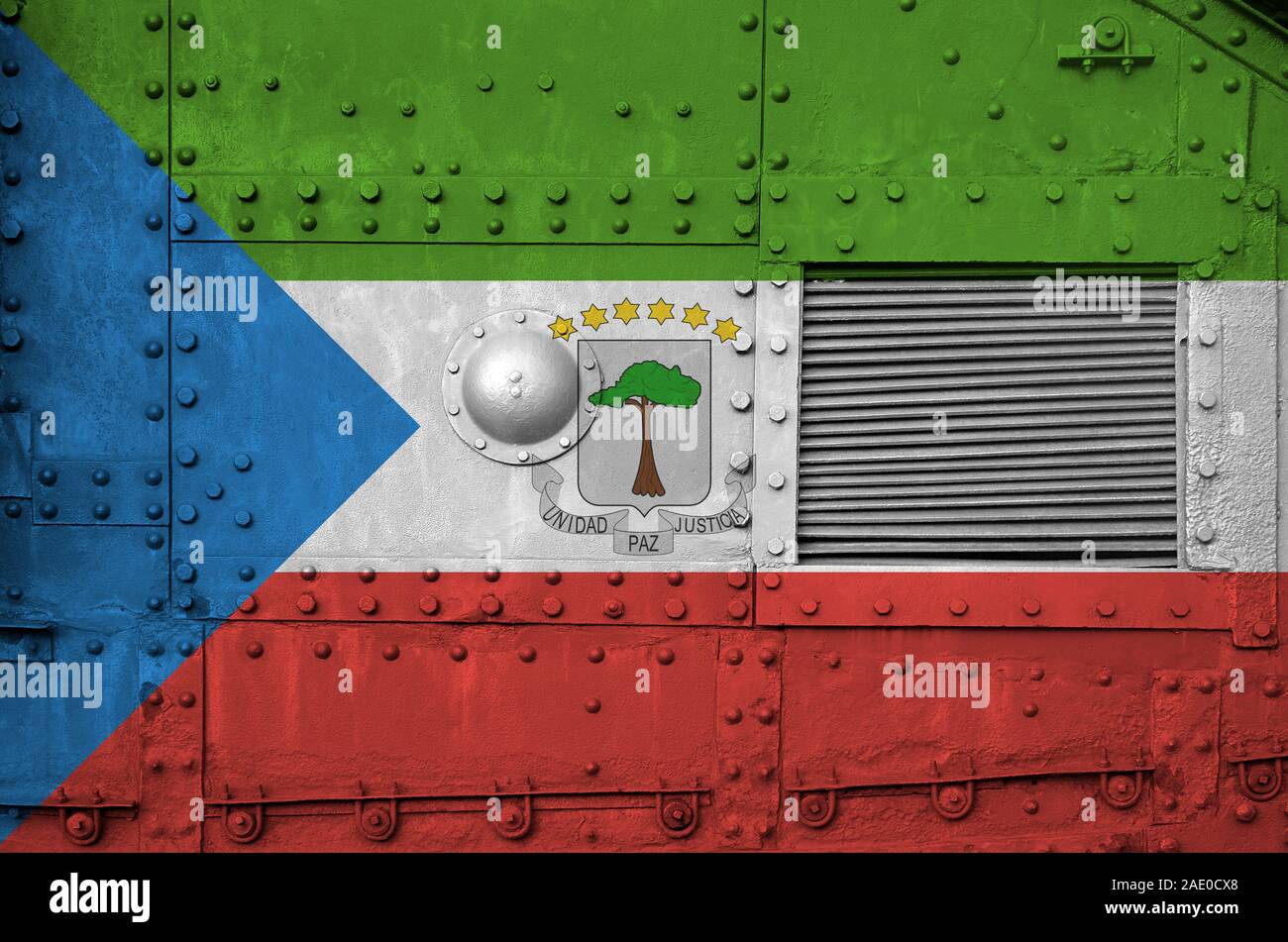 Equatorial Guinea flag depicted on side part of military armored tank ...