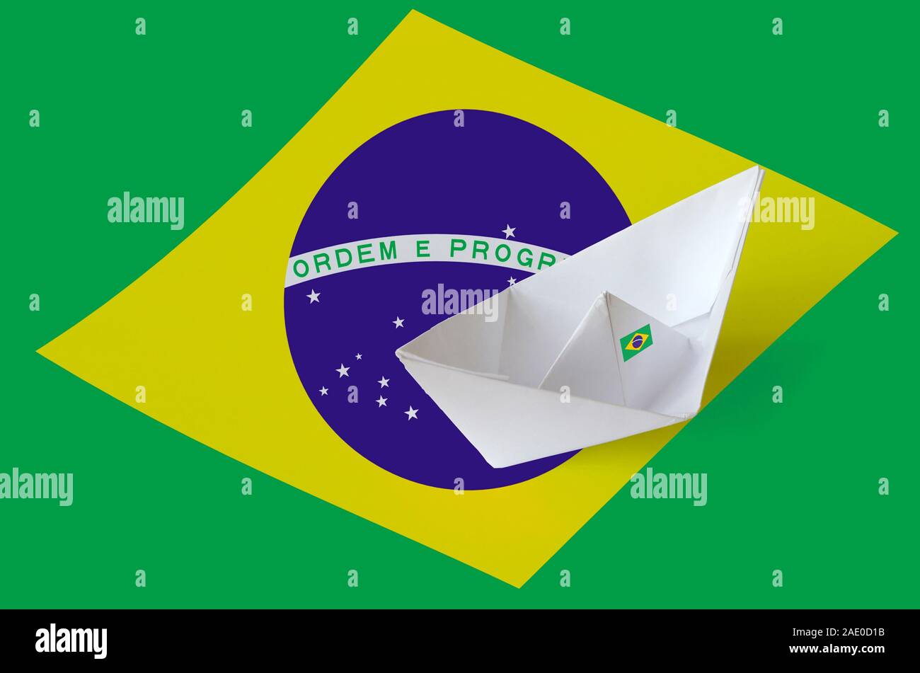 Brazil flag depicted on paper origami ship closeup. Oriental handmade ...