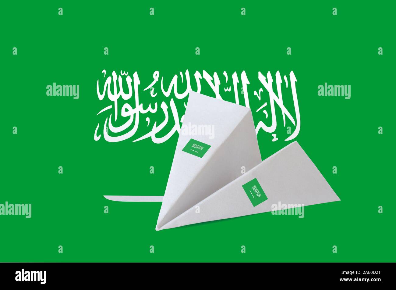 Saudi Arabia flag depicted on paper origami airplane. Oriental handmade ...