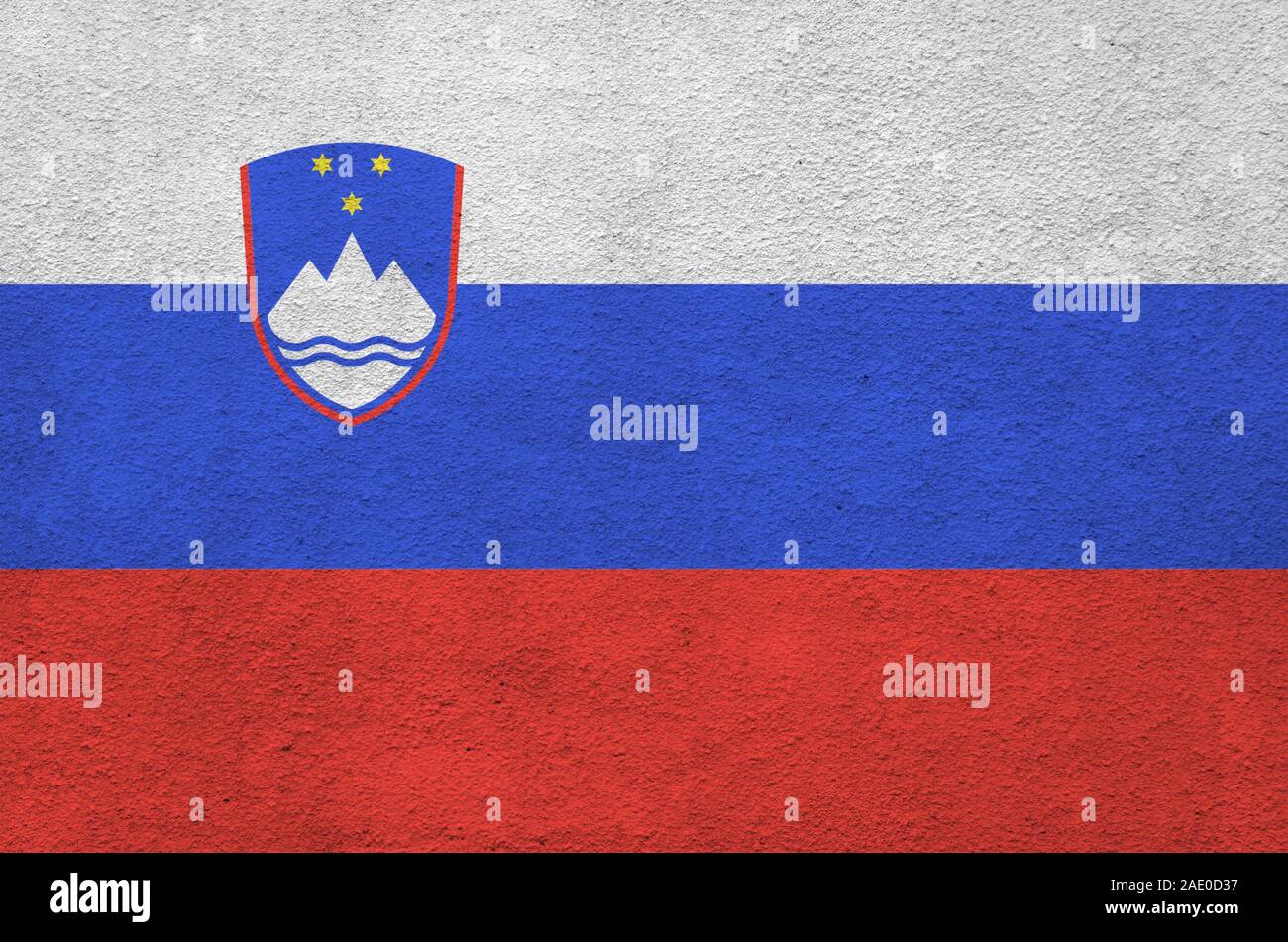 Slovenia flag depicted in bright paint colors on old relief plastering ...