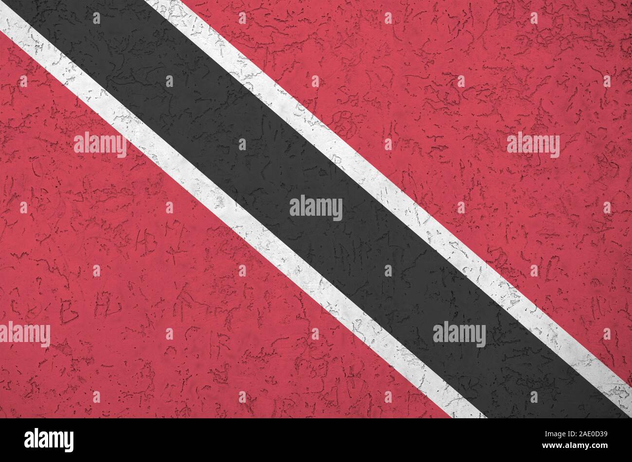 Trinidad and Tobago flag depicted in bright paint colors on old relief ...