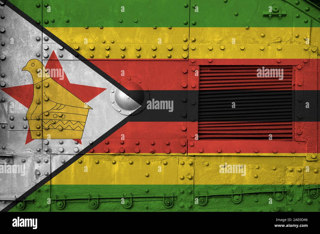 Zimbabwe flag depicted on side part of military armored tank close up ...