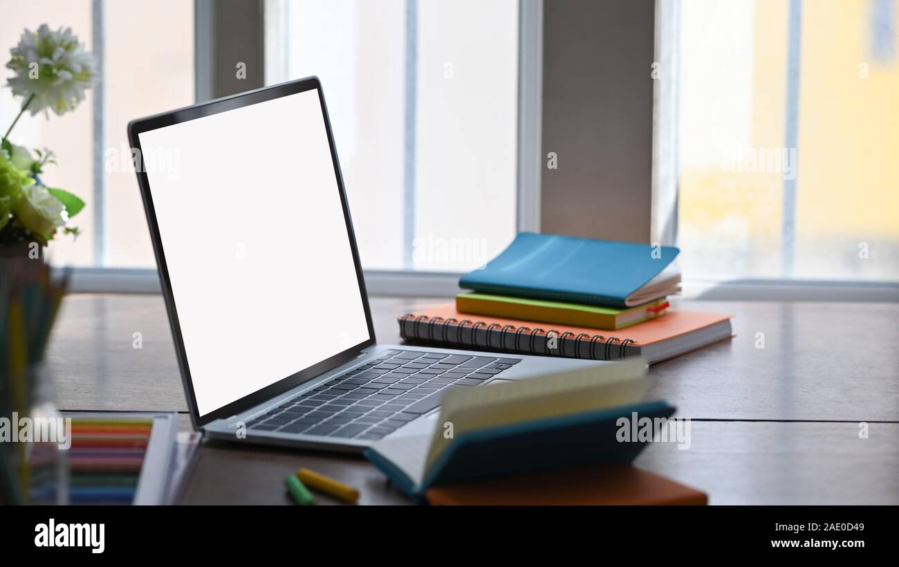 Side view laptop empty screen on creative table Stock Photo - Alamy