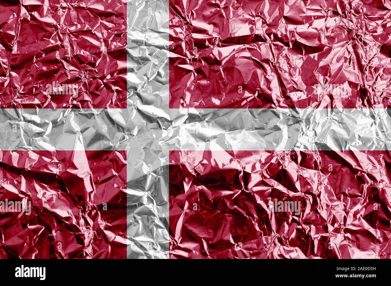 Denmark flag depicted in paint colors on shiny crumpled aluminium foil ...