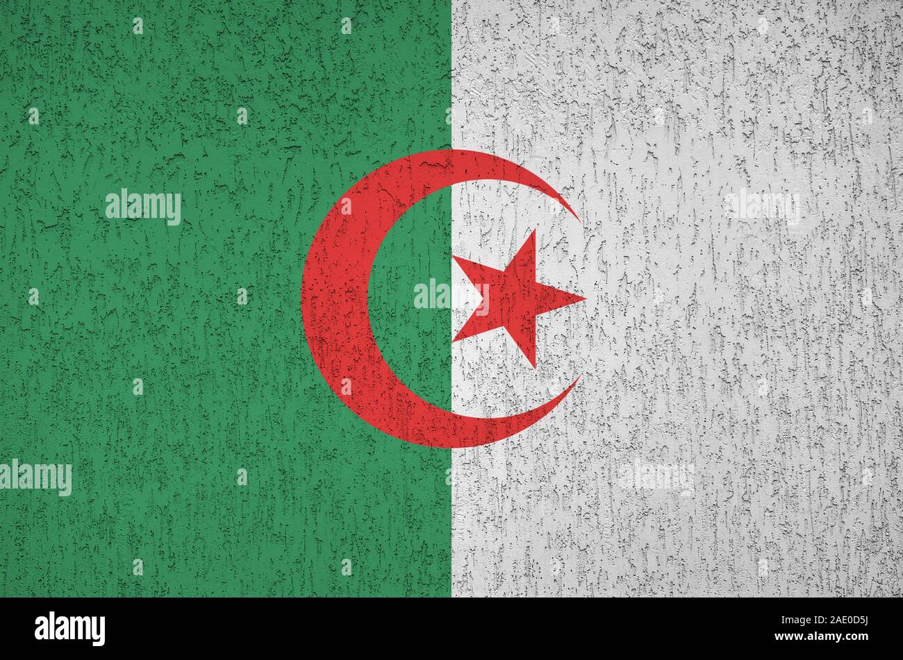Algeria flag depicted in bright paint colors on old relief plastering ...