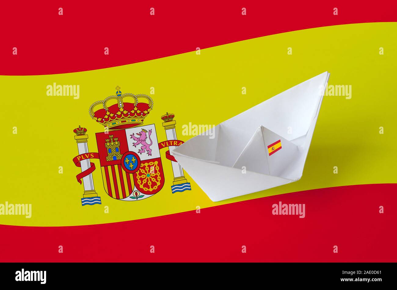 Spain flag depicted on paper origami ship closeup. Oriental handmade ...