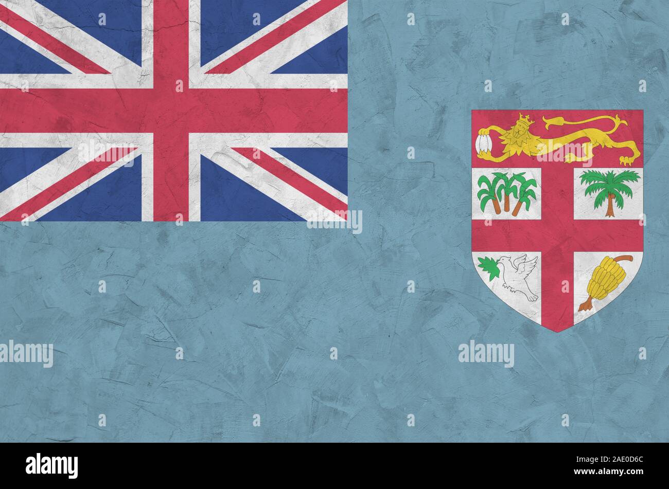 Fiji flag depicted in bright paint colors on old relief plastering wall ...