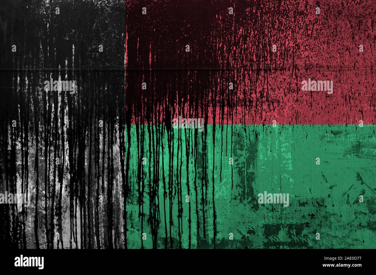 Madagascar flag depicted in paint colors on old and dirty oil barrel ...