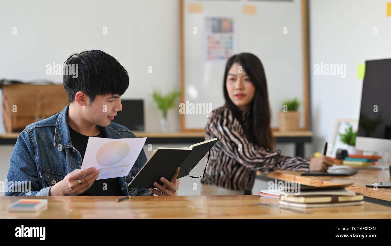 Designing at computer in art studio hi-res stock photography and images ...