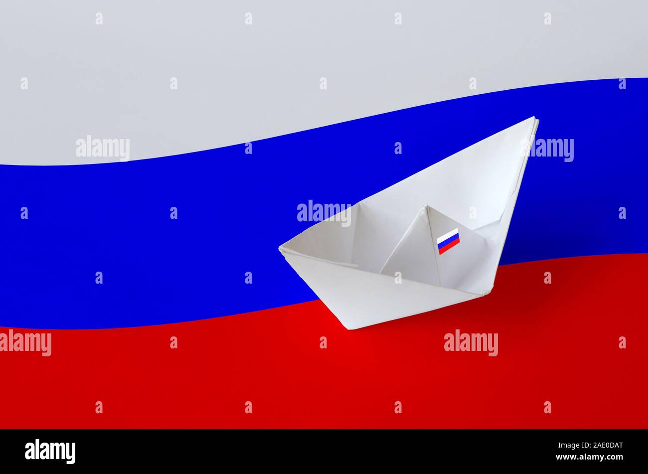 Russia flag depicted on paper origami ship closeup. Oriental handmade ...