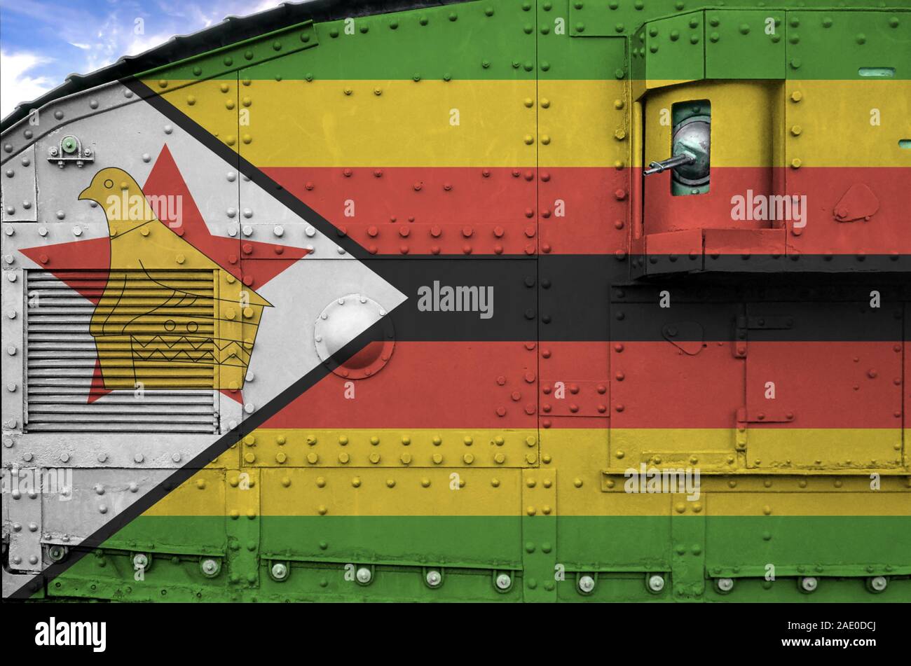 Zimbabwe flag depicted on side part of military armored tank close up ...