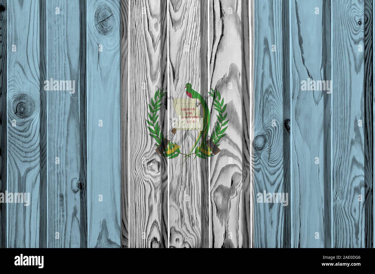 Guatemala flag depicted in bright paint colors on old wooden wall close ...