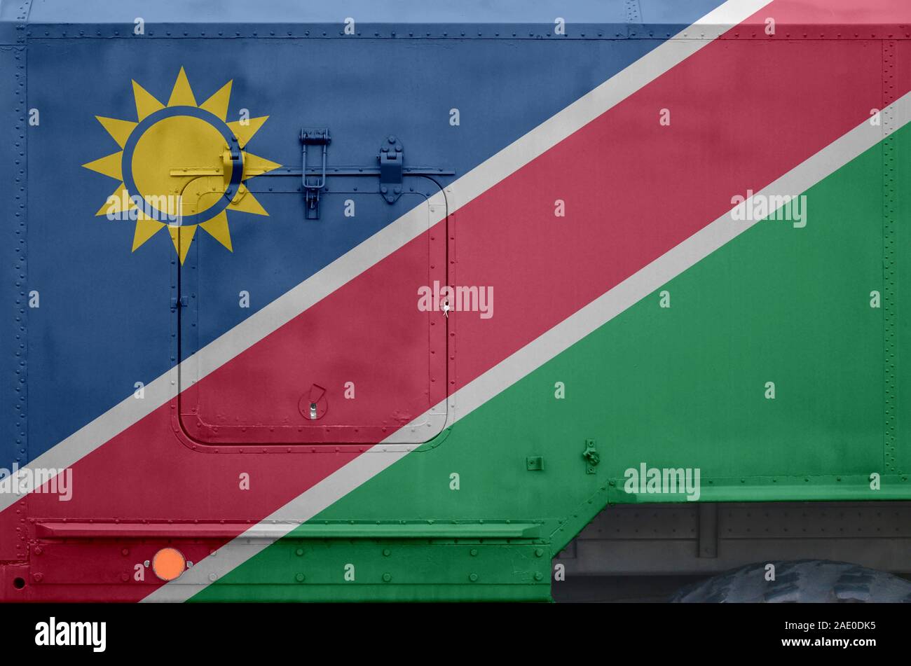 Namibia flag depicted on side part of military armored truck close up ...