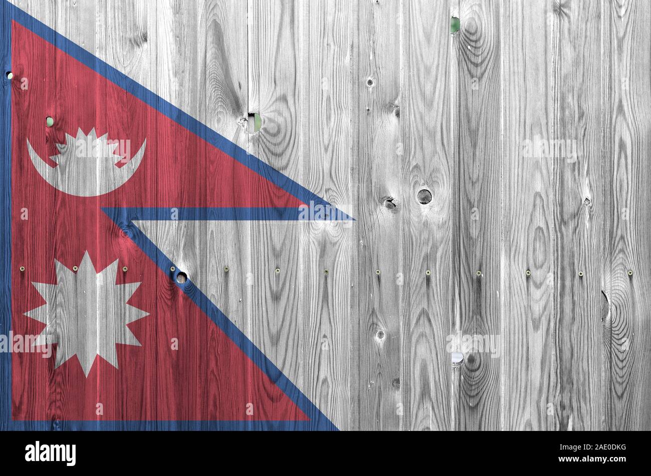 Nepal flag depicted in bright paint colors on old wooden wall close up ...