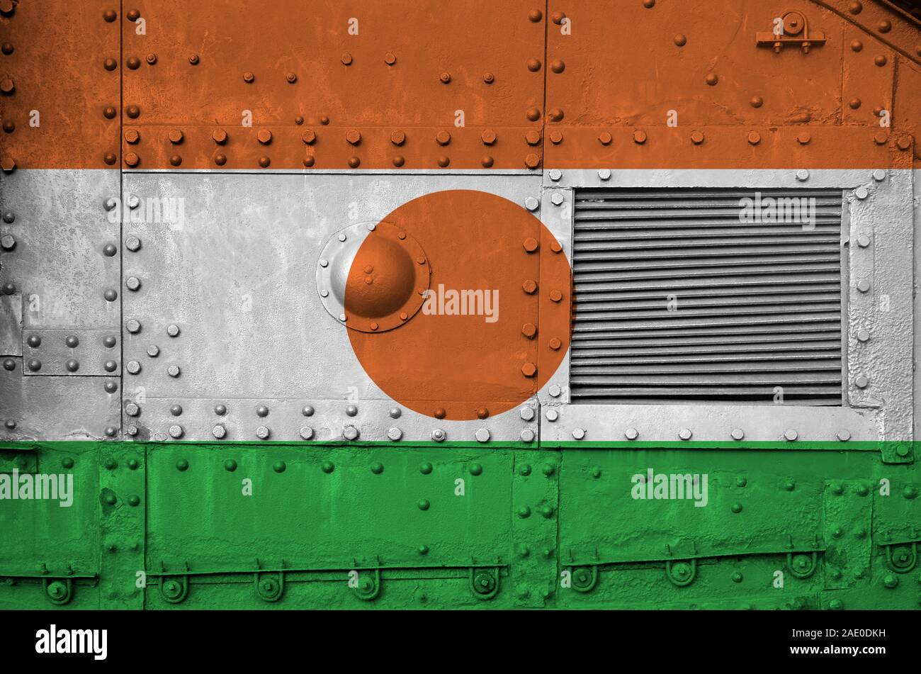 Niger flag depicted on side part of military armored tank close up ...