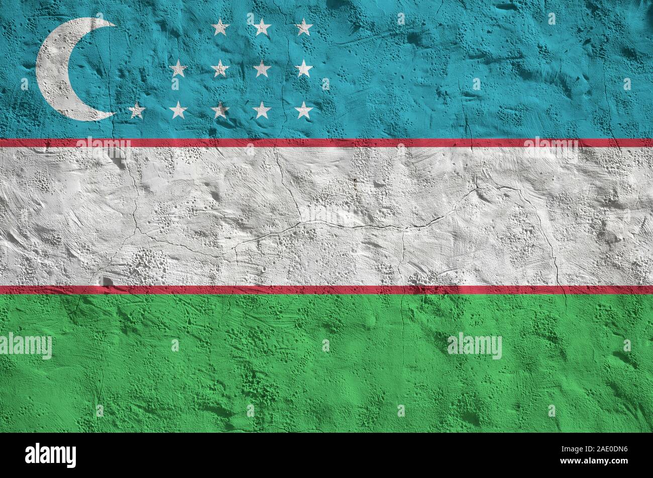 Uzbekistan flag depicted in bright paint colors on old relief ...