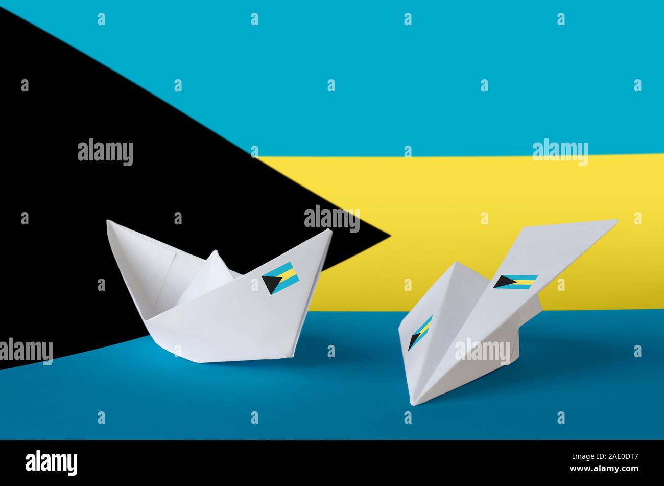 Bahamas flag depicted on paper origami airplane and boat. Oriental ...