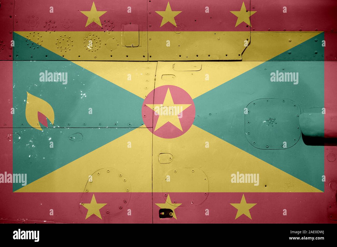 Grenada flag depicted on side part of military armored helicopter close ...