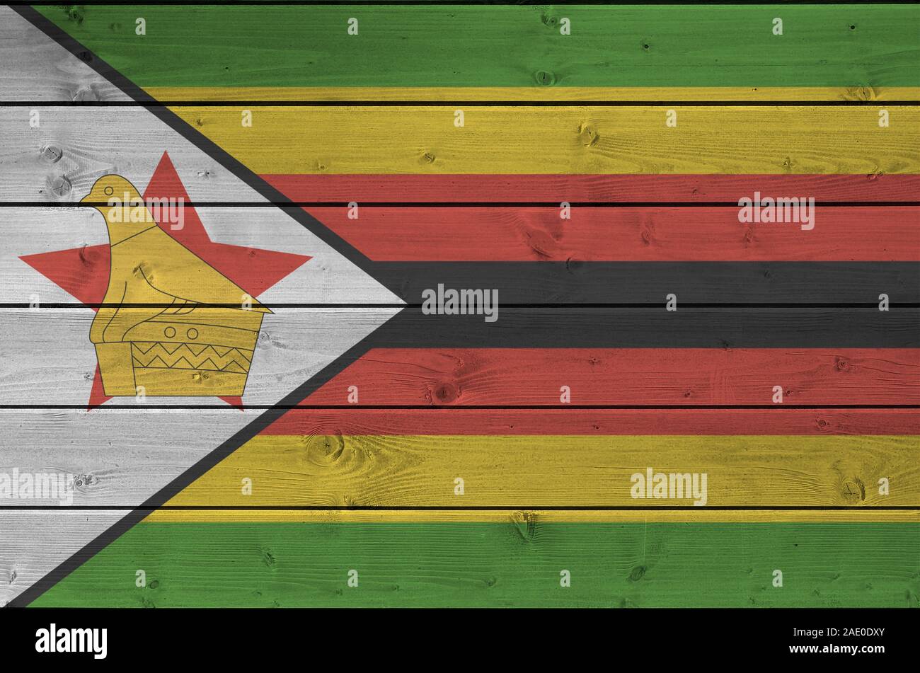 Zimbabwe flag depicted in bright paint colors on old wooden wall close ...