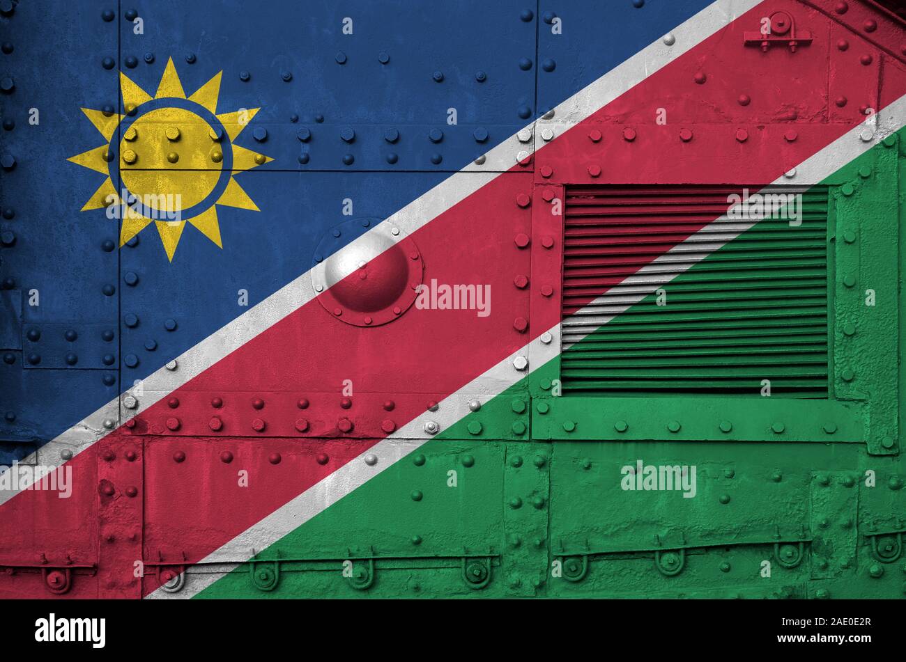 Namibia flag depicted on side part of military armored tank close up ...
