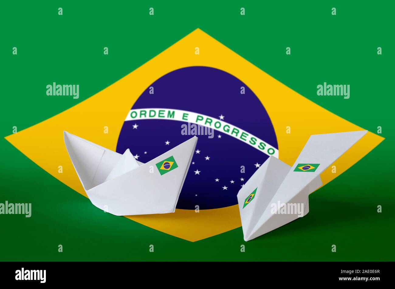 Brazil flag depicted on paper origami airplane and boat. Oriental ...