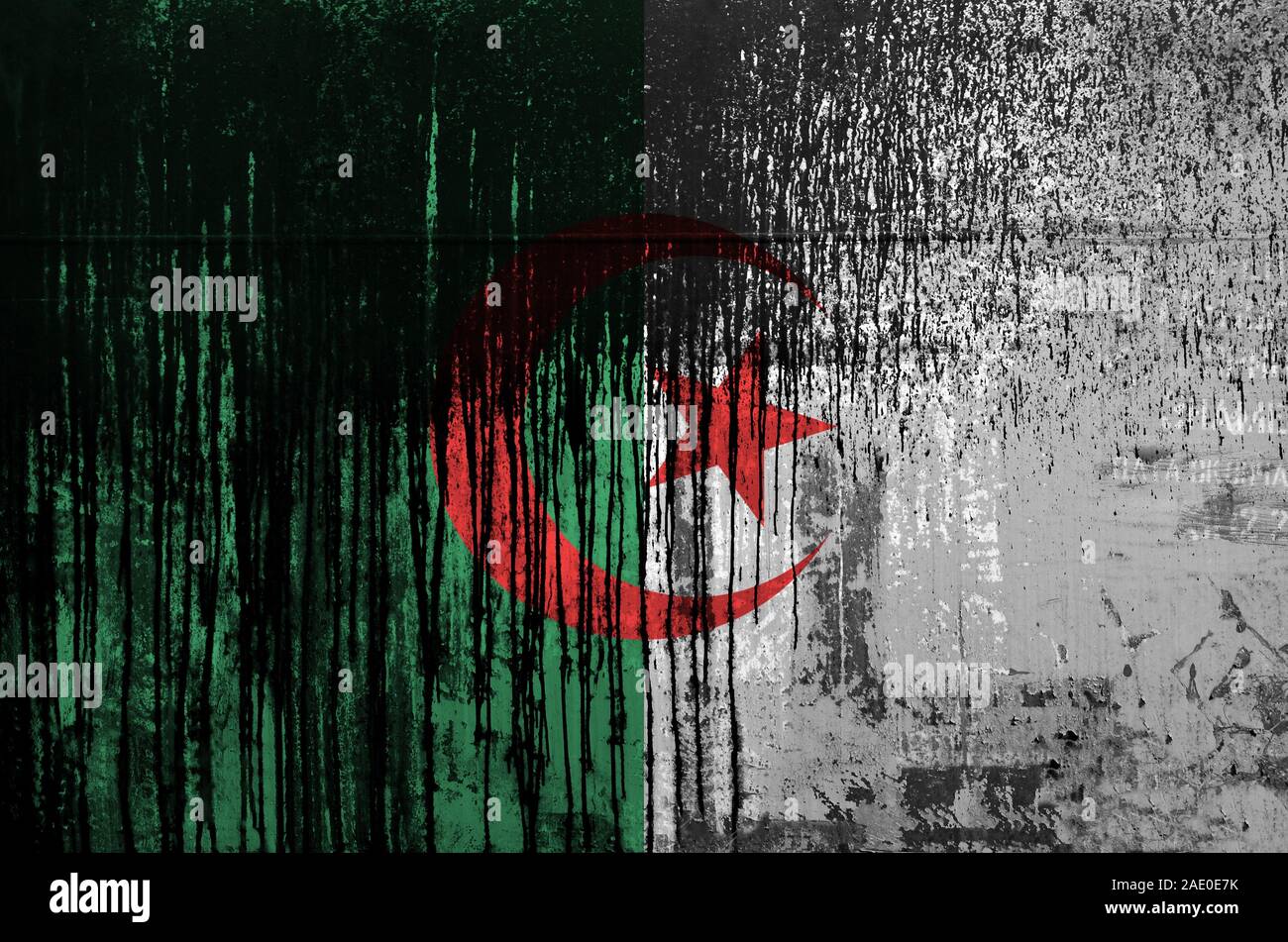 Algeria flag depicted in paint colors on old and dirty oil barrel wall ...