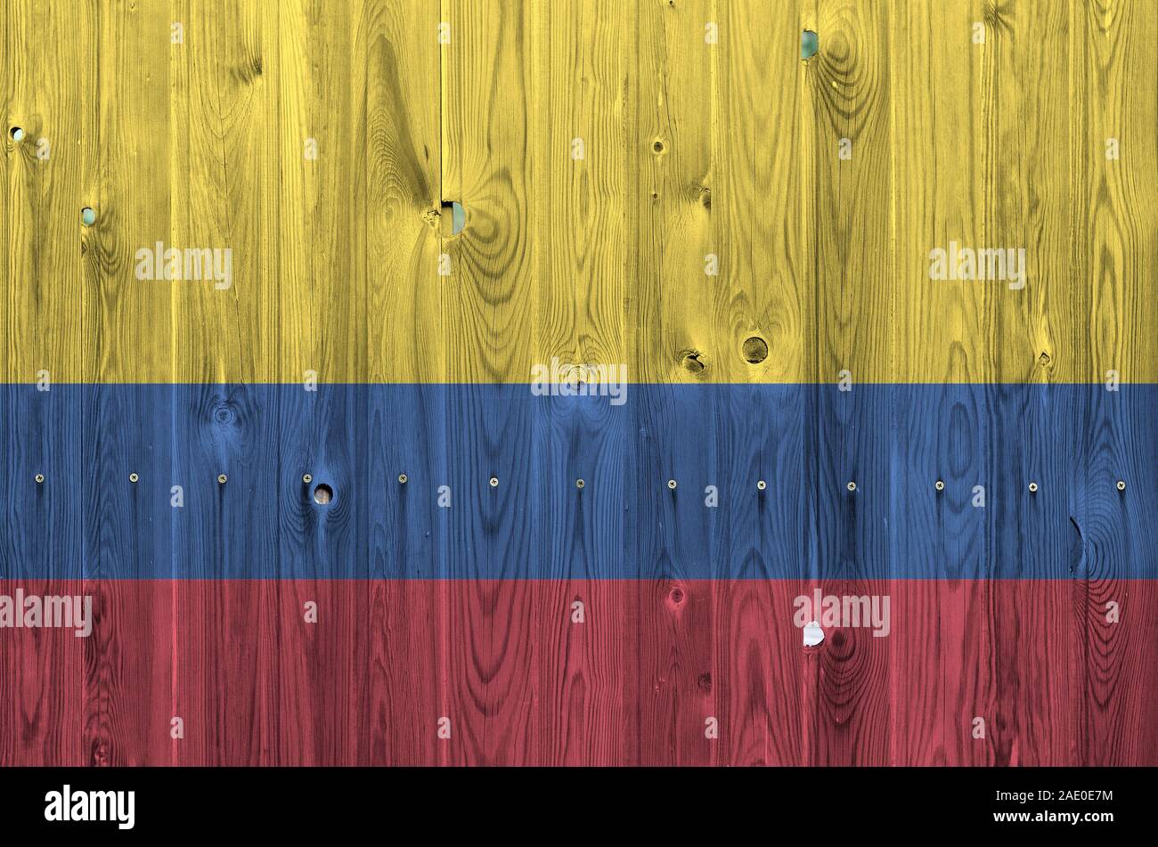 Colombia flag depicted in bright paint colors on old wooden wall close ...