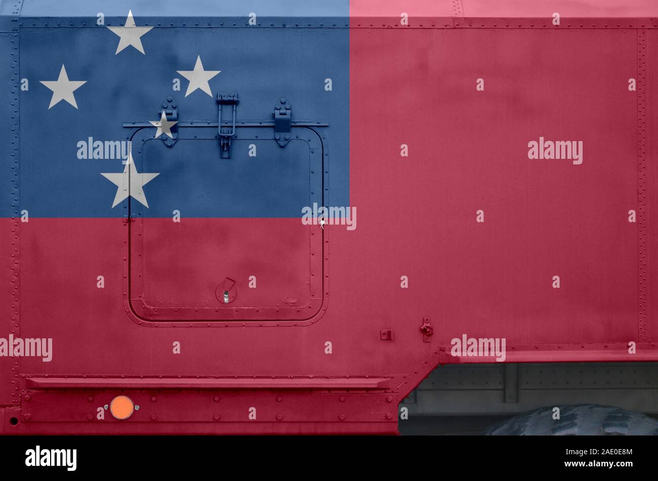 Samoa flag depicted on side part of military armored truck close up ...