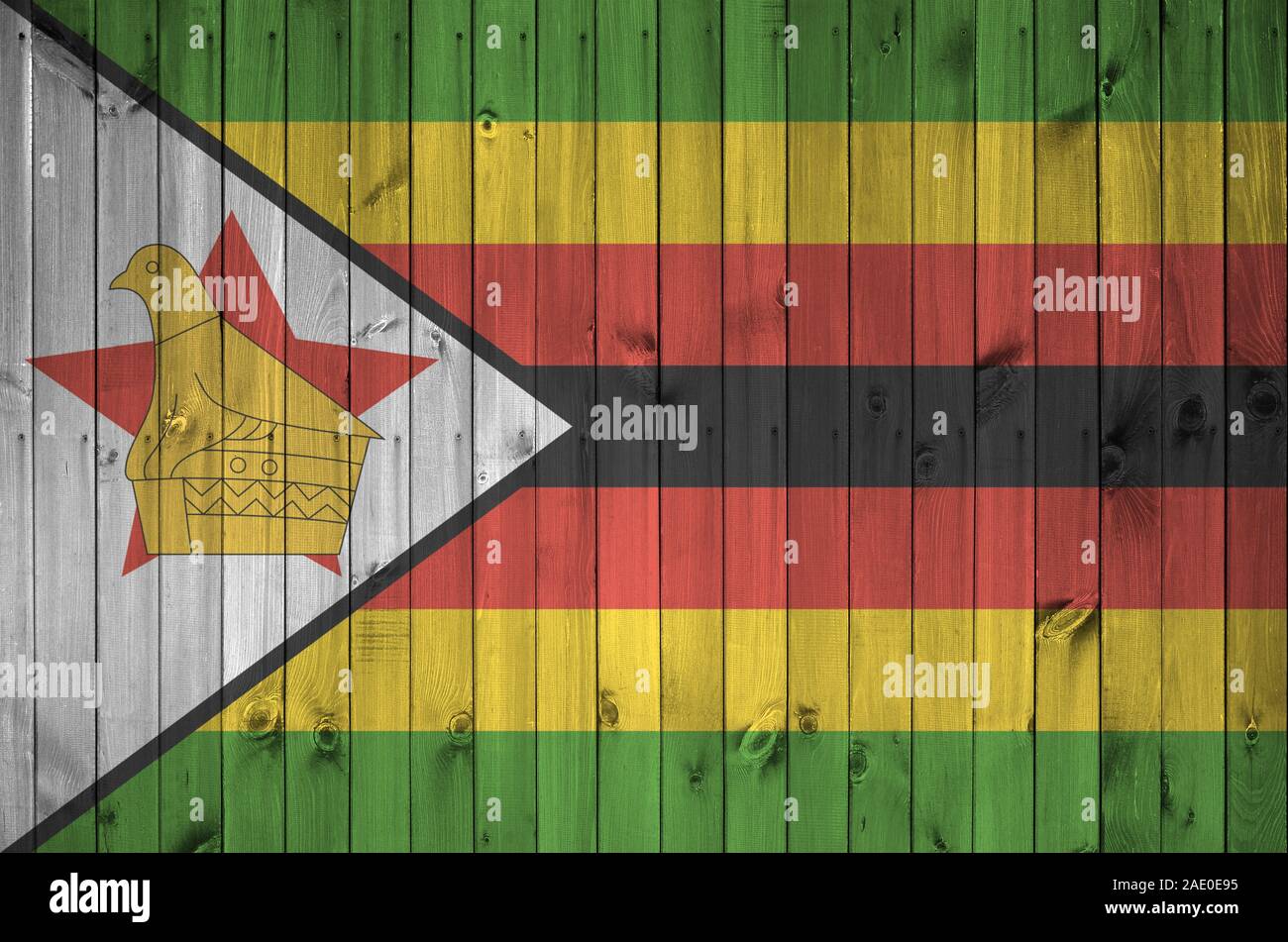 Zimbabwe flag depicted in bright paint colors on old wooden wall close ...