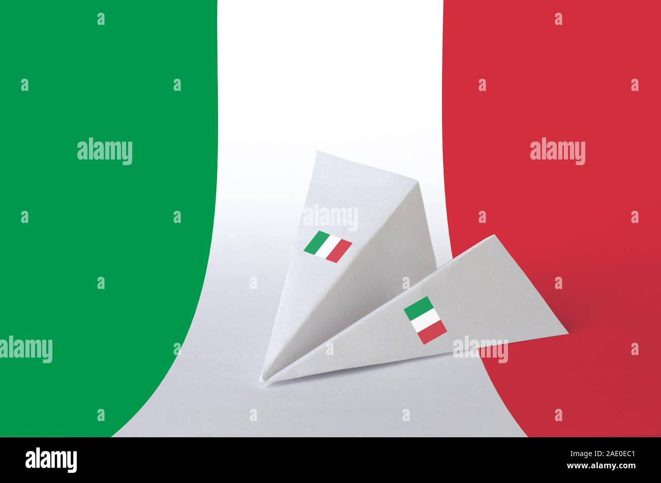 Italy flag depicted on paper origami airplane. Oriental handmade arts ...
