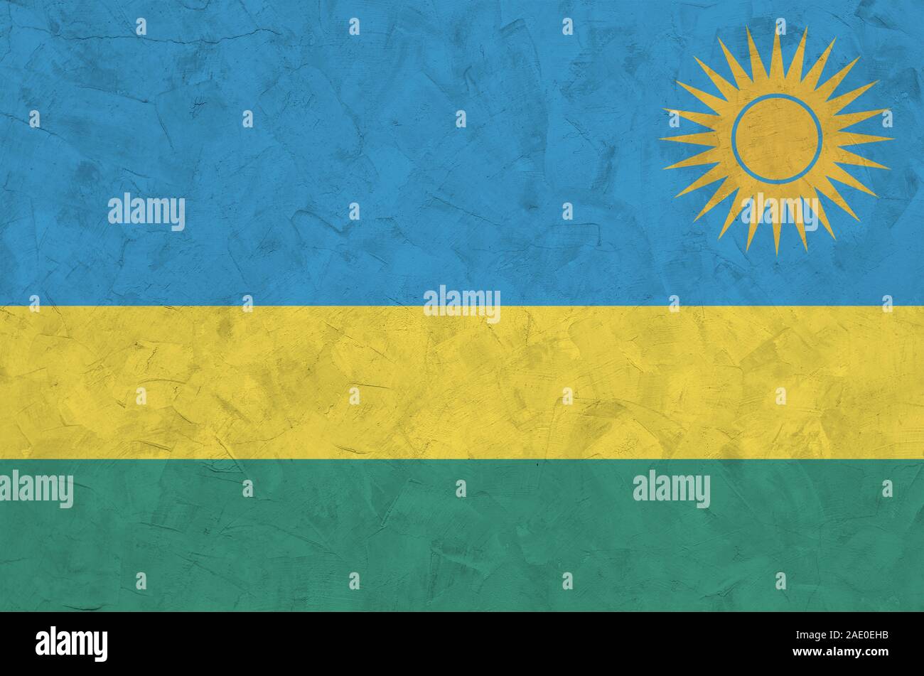 Rwanda flag depicted in bright paint colors on old relief plastering ...