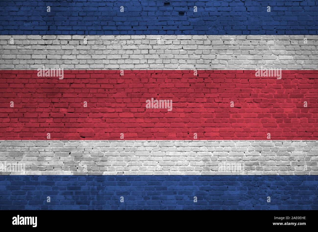 Costa Rica flag depicted in paint colors on old brick wall close up ...