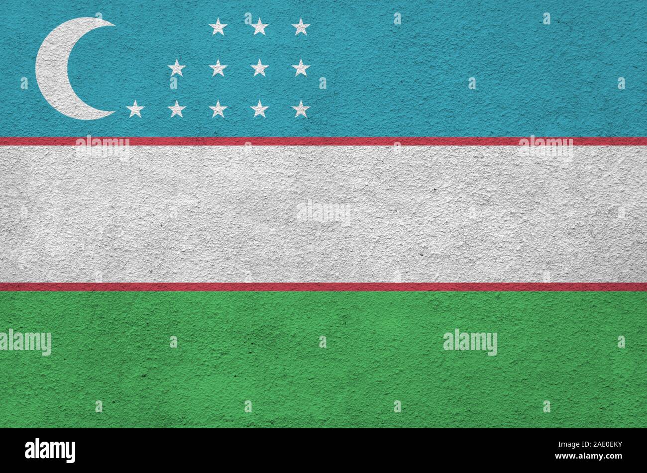 Uzbekistan flag depicted in bright paint colors on old relief ...