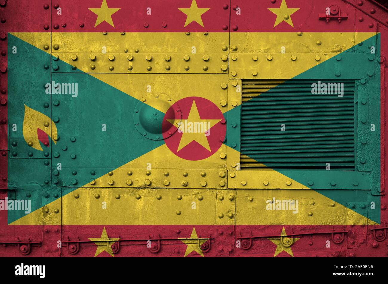 Grenada flag depicted on side part of military armored tank close up ...