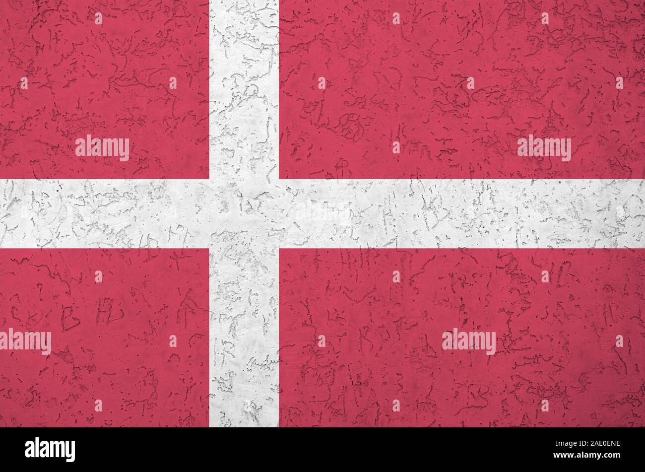 Denmark flag depicted in bright paint colors on old relief plastering ...