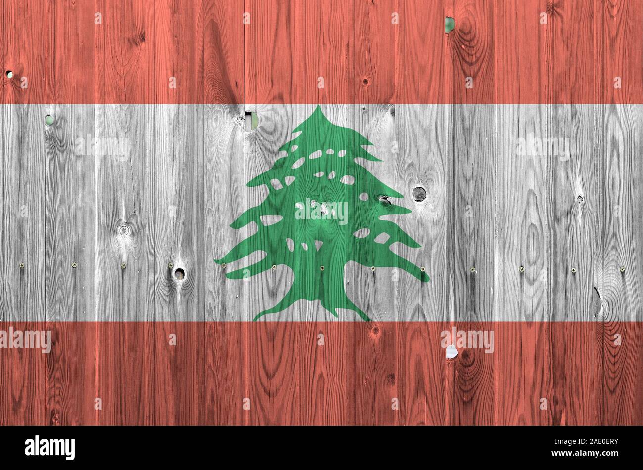 Lebanon flag depicted in bright paint colors on old wooden wall close ...