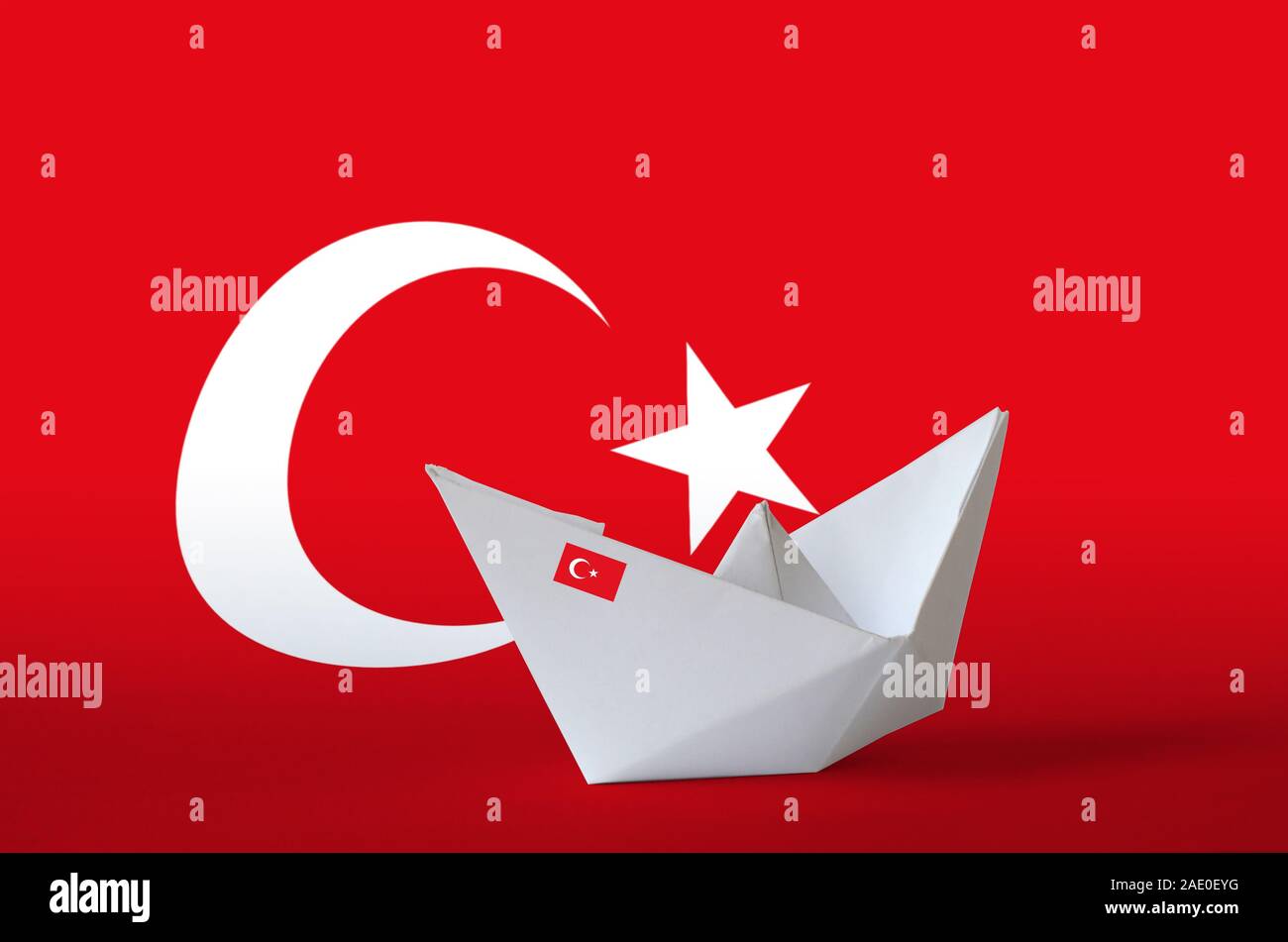 Turkey flag depicted on paper origami ship closeup. Oriental handmade ...