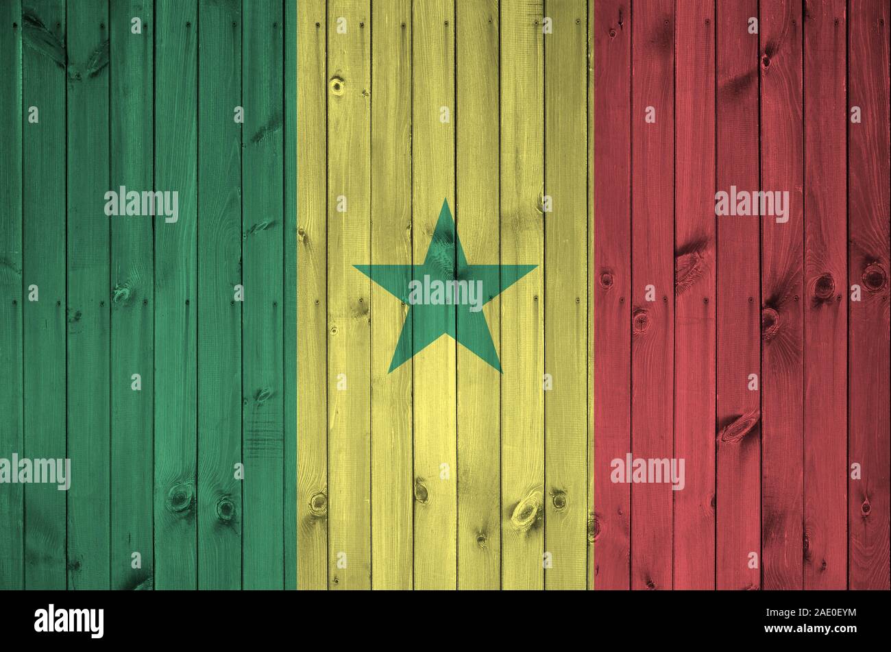 Senegal flag depicted in bright paint colors on old wooden wall close ...
