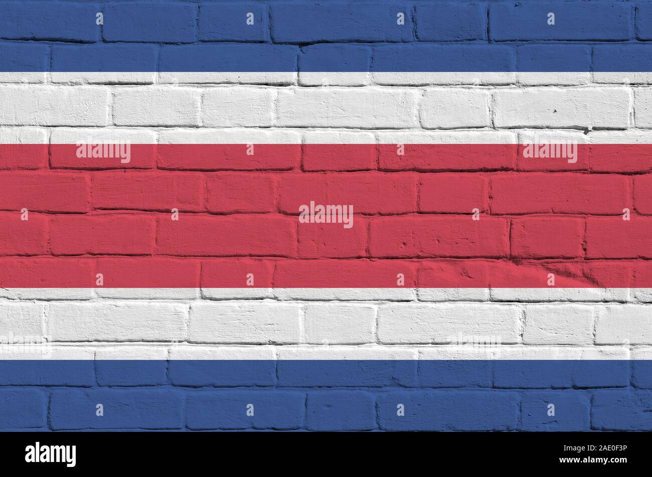 Costa Rica flag depicted in paint colors on old brick wall close up ...