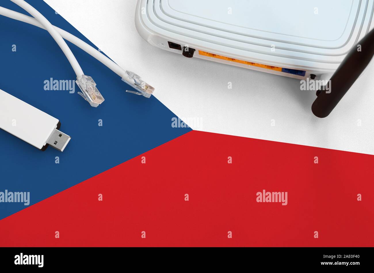 Czech flag depicted on table with internet rj45 cable, wireless usb wi ...