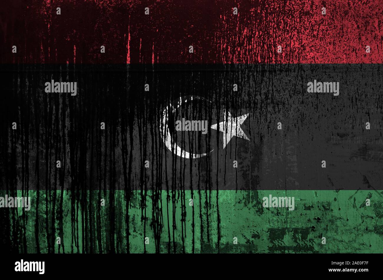 Libya flag depicted in paint colors on old and dirty oil barrel wall ...