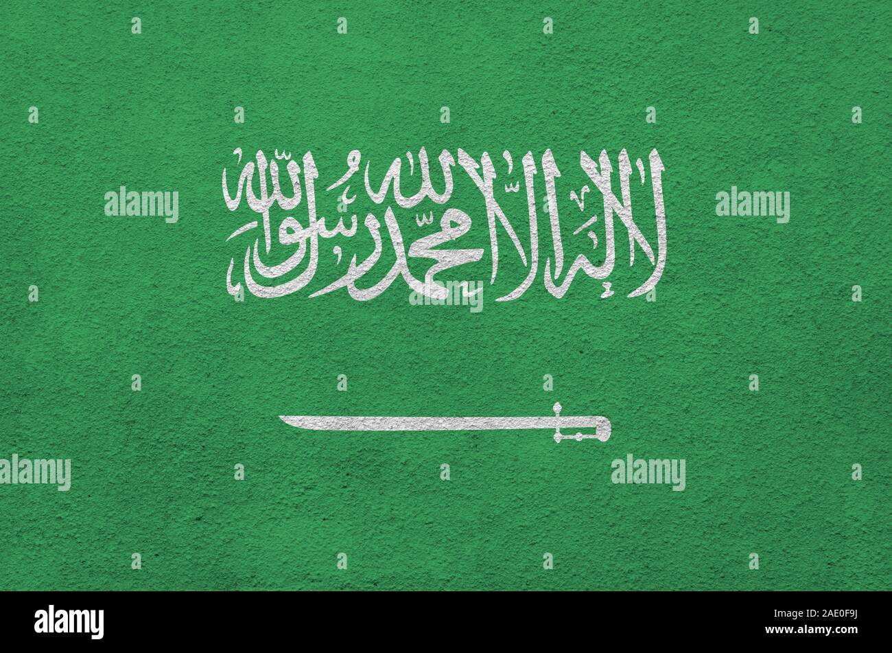 Saudi Arabia flag depicted in bright paint colors on old relief ...