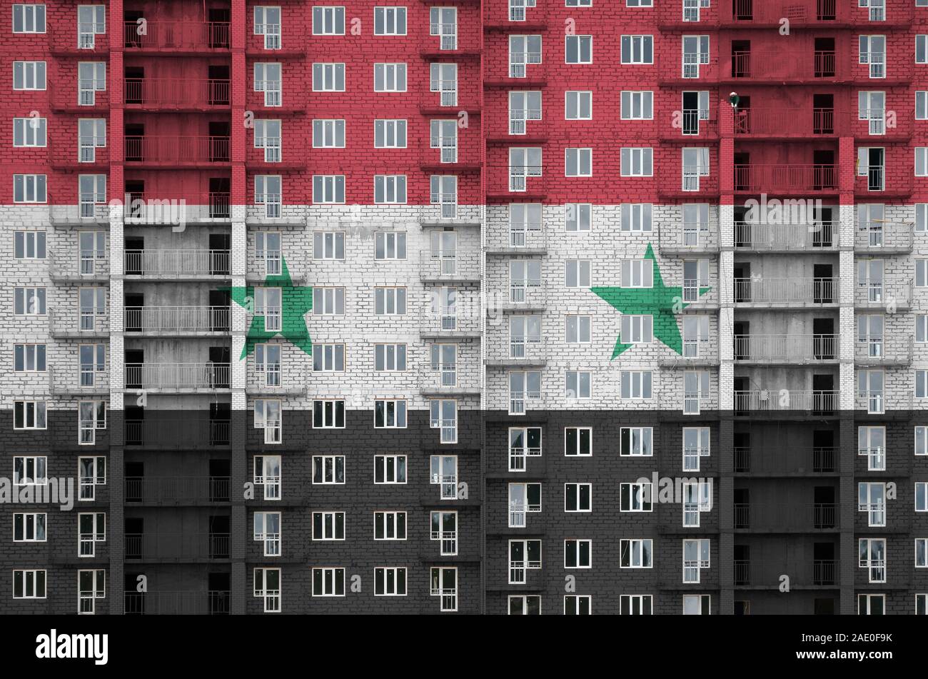 Syria flag depicted in paint colors on multi-storey residental building ...