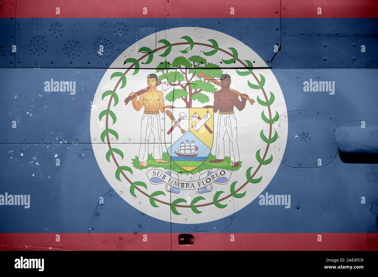 Belize flag depicted on side part of military armored helicopter close ...