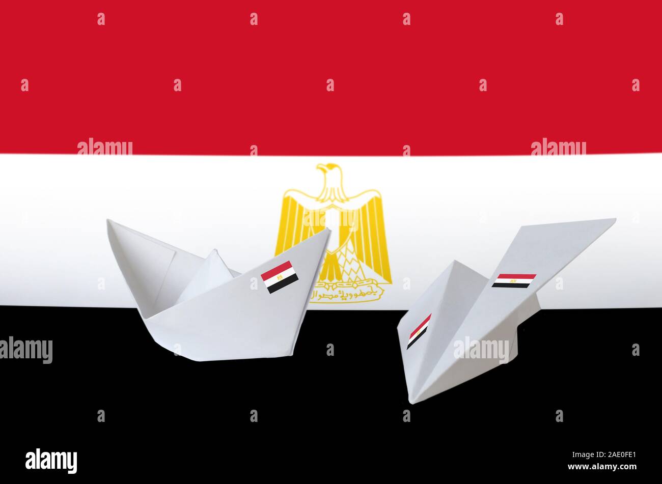Egypt flag depicted on paper origami airplane and boat. Oriental ...