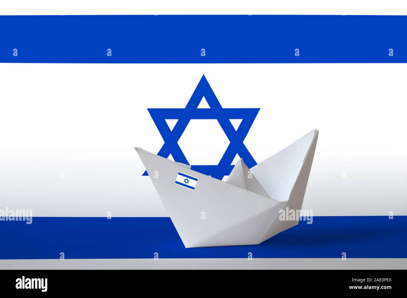 Israel flag depicted on paper origami ship closeup. Oriental handmade ...